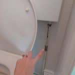 Where is the toilet isolation valve on a toilet?